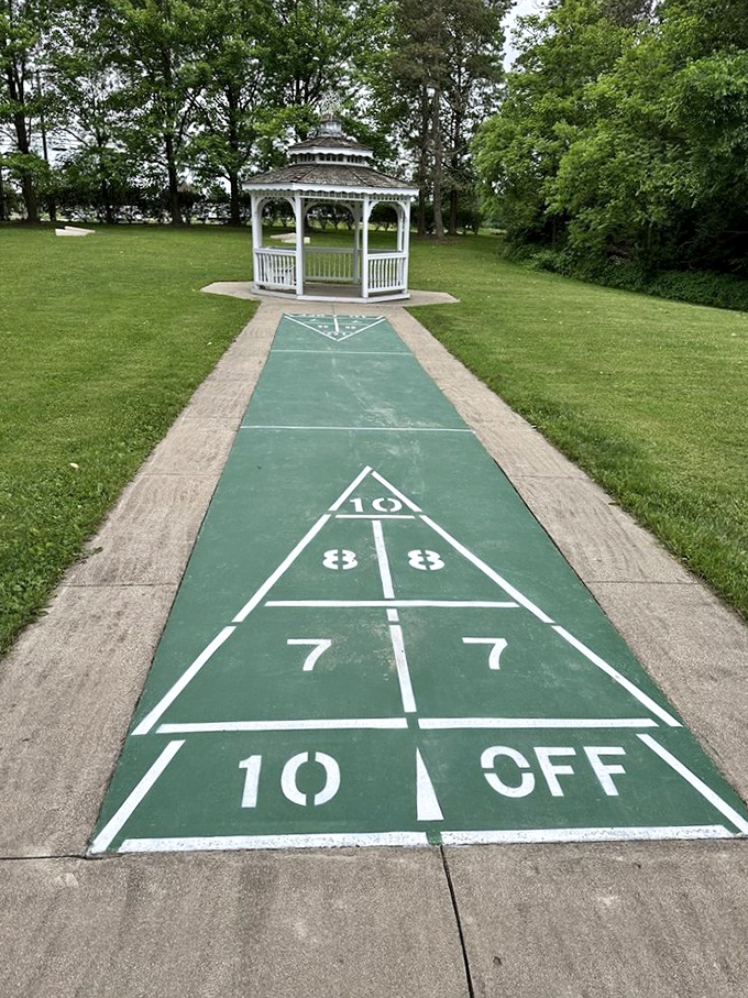 Shuffleboard with a gazebo backdrop - because even games deserve a little architectural elegance.