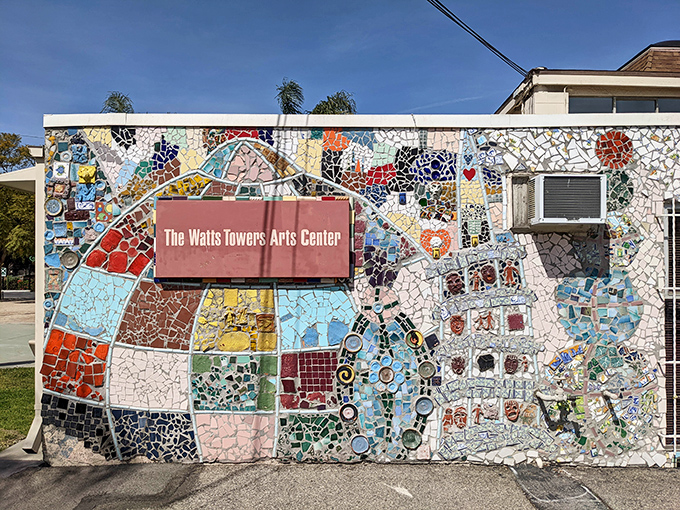 The Arts Center's exterior continues the mosaic tradition, proving that in Watts, even the signage becomes an opportunity for artistic expression.