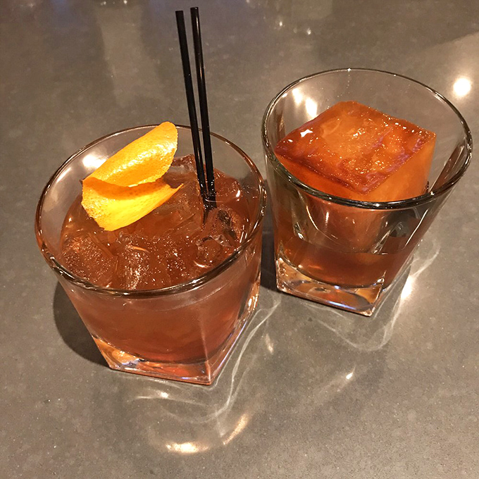 Craft cocktails meet barbecue culture where smoky old fashioneds complement the restaurant's signature whiskey selections perfectly.