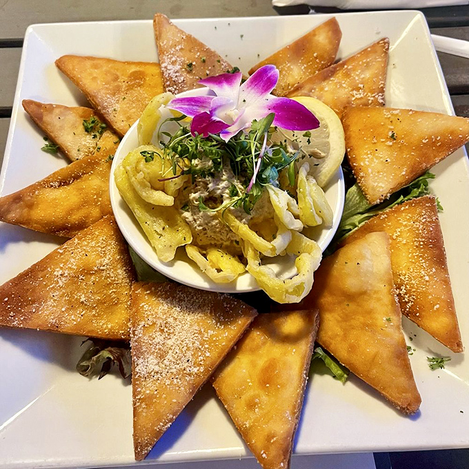 Triangles of joy surround what might be the world's most elegant tuna dip&mdash;proof that even appetizers deserve the royal treatment at Copper Tap.