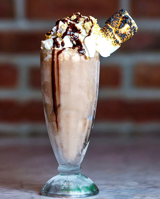 Not so much a milkshake as a dessert skyscraper, complete with a toasted marshmallow penthouse suite.