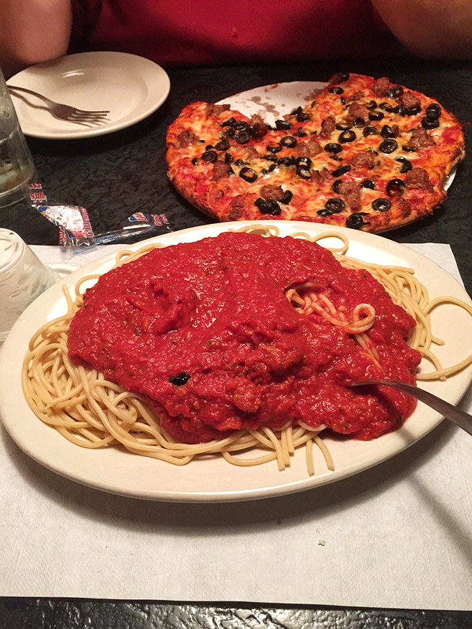 Their spaghetti arrives under a blanket of rich, vibrant sauce so generous it makes you wonder if they're secretly trying to end tomato overpopulation in Ohio.