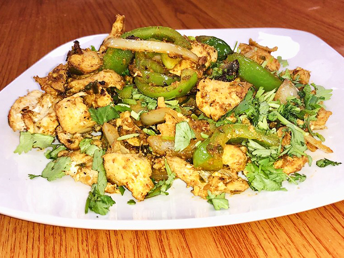 Spiced chicken and peppers dance together on this plate like they were meant for each other.