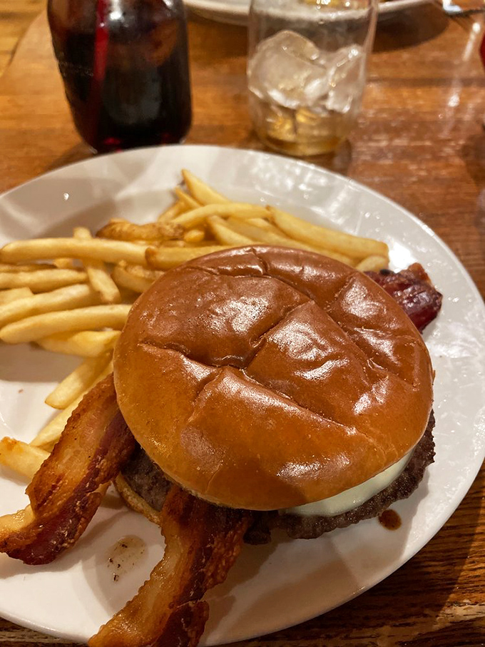 A burger that doesn't need fancy toppings to impress, just quality ingredients and those perfectly crisp bacon strips standing at attention.