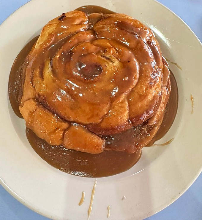 This sticky bun isn't just breakfast – it's dessert masquerading as a morning meal. Sweet, gooey perfection on a plate.