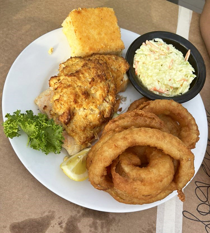 A plate that answers the eternal question: "What if we stuffed even more seafood into this fish?" The answer is delicious.