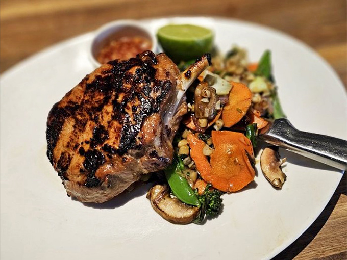 This pork chop with its perfectly charred edges is having a better glamour shot than most celebrities on magazine covers.