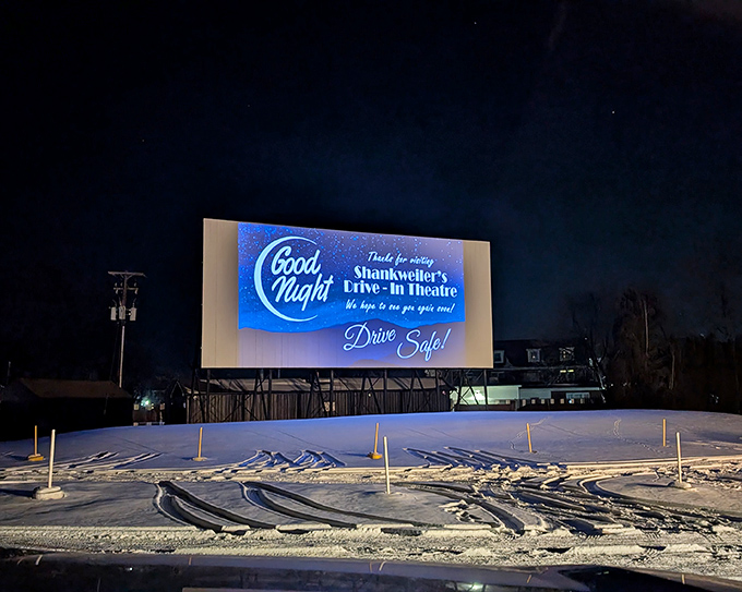 The "Good Night" message glows against the winter snow, a warm farewell until the next double feature under the stars.