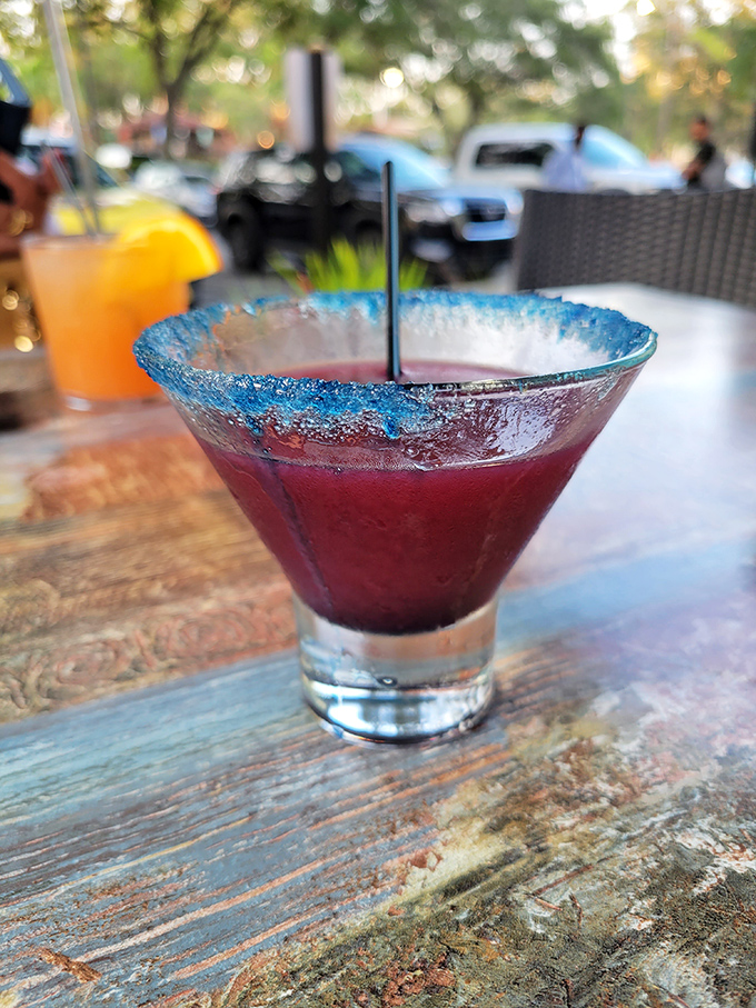 This electric blue-rimmed margarita isn't just a drink, it's a vacation in a glass &ndash; the kind that makes you forget you have emails waiting.