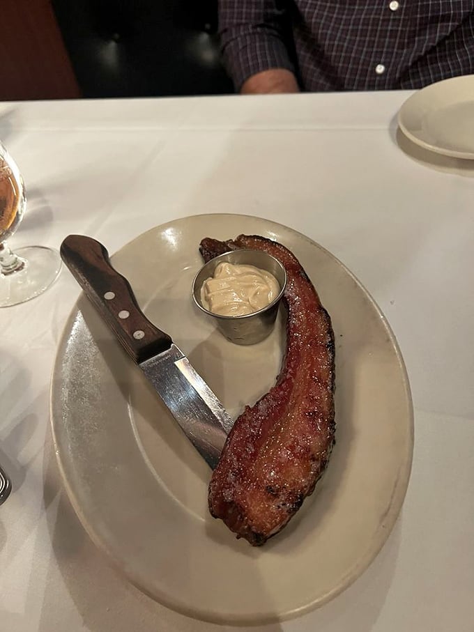 Thick-cut bacon that makes regular bacon look like it needs to hit the gym. This isn't a side dish—it's the main event with a supporting cast of horseradish.