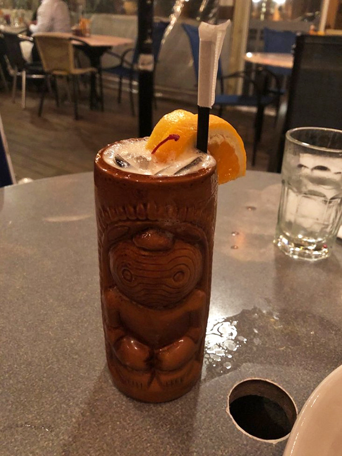 A tiki drink that's wearing more accessories than a Palm Springs retiree. That orange slice isn't decoration&mdash;it's a vitamin C delivery system.