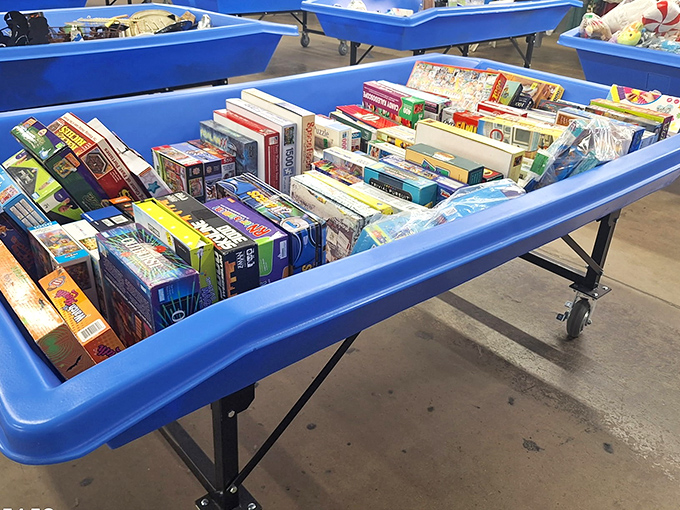 Board games, puzzles, and childhood nostalgia fill these blue bins &ndash; where memories are priced by the piece instead of by the gigabyte.