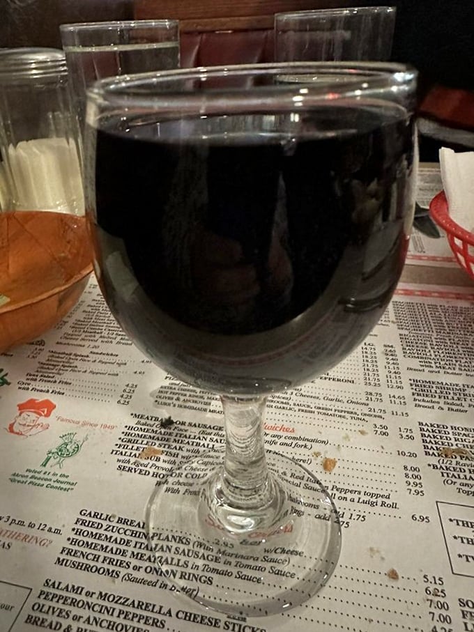 Wine in a stemmed glass on a checkered tablecloth&mdash;some traditions exist because they're perfect. Simple pleasures are often the most satisfying.