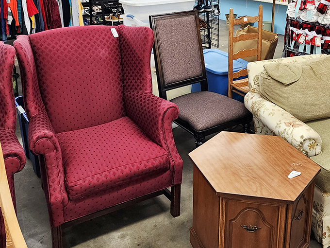 This burgundy wingback chair isn't just furniture—it's a throne waiting for the right person to give it a second chance at living room royalty.