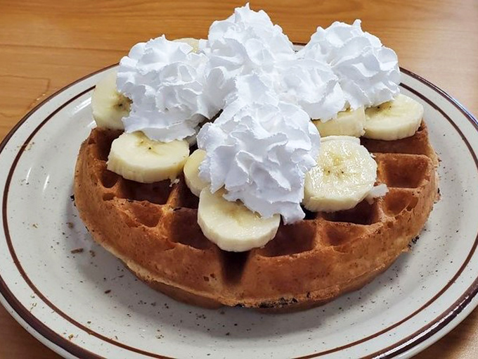 This waffle with bananas and whipped cream is what breakfast looks like in the dreams of well-behaved children.