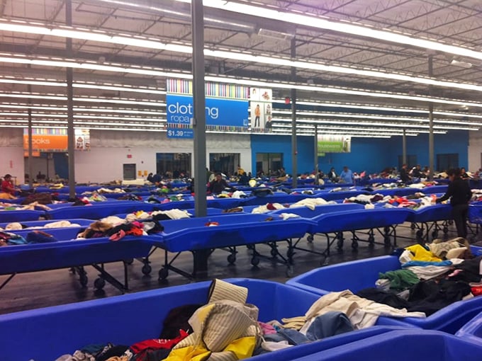 A sea of textile potential stretches across the warehouse floor. Somewhere in this fabric ocean swims the vintage band t-shirt of your dreams.