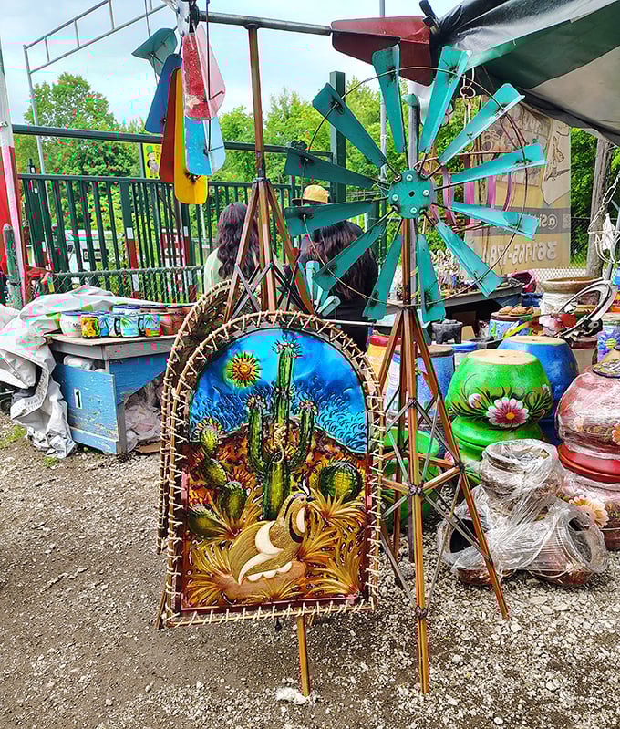 Garden art that dances in the breeze! This handcrafted windmill and desert scene bring whimsy to any outdoor space.