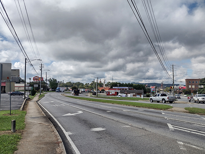 Main Street stretches toward distant hills, a ribbon of asphalt connecting neighborhoods where people still wave to passing cars.