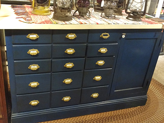 Navy blue with brass hardware&mdash;this apothecary-style cabinet could organize everything from craft supplies to cocktail ingredients with vintage panache.