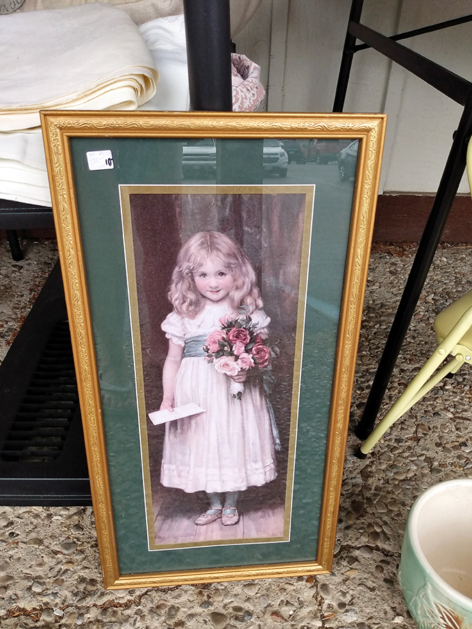 Victorian charm captured in gilt and glass. This little girl has been patiently holding her flowers for generations.