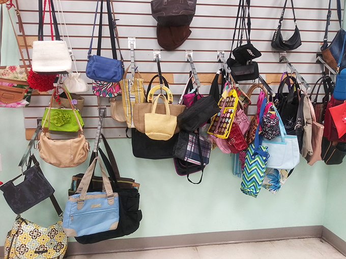 The handbag wall&mdash;a colorful tapestry of previous fashion eras where vintage Coach mingles democratically with beach totes and everything in between.
