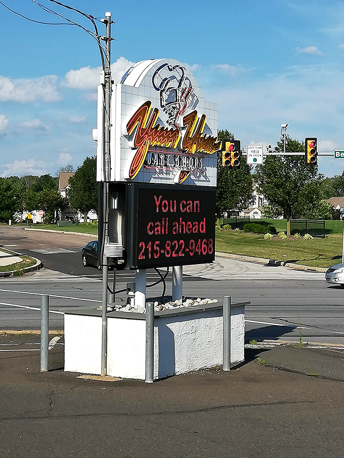 The neon sign glows like a lighthouse for the hungry, guiding Pennsylvania's breakfast seekers safely to donut harbor.