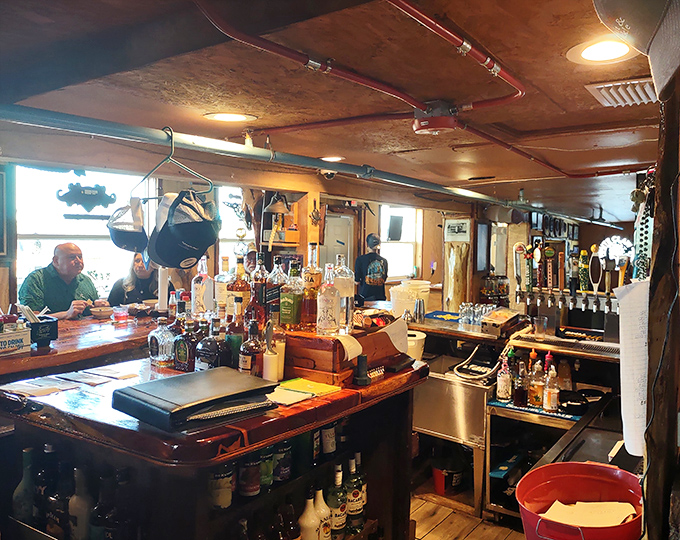 The bar where stories flow as freely as the drinks. Wood-worn and welcoming, it's where strangers become friends over cold beers.