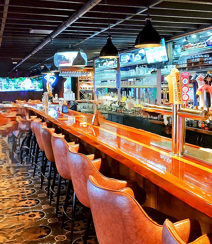 A bar that beckons like an old friend, promising cold drinks and warm conversation under the glow of pendant lights.