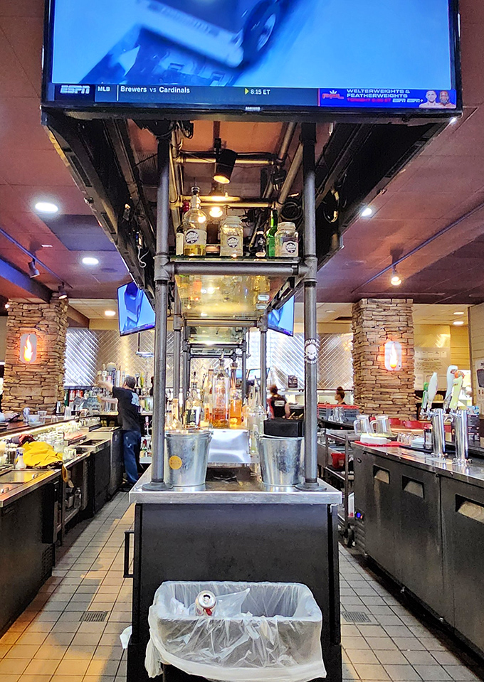A bar setup that says "we take our liquid refreshments as seriously as our smoked meats." The TV ensures you won't miss a play while refueling.