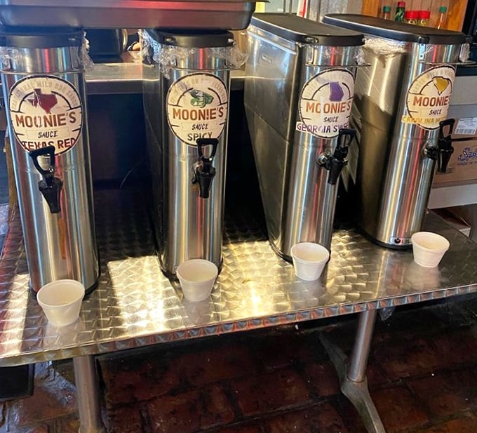 The sauce dispensers stand at attention like soldiers guarding flavor treasures. Choose your weapon wisely&mdash;each brings its own personality to the party.