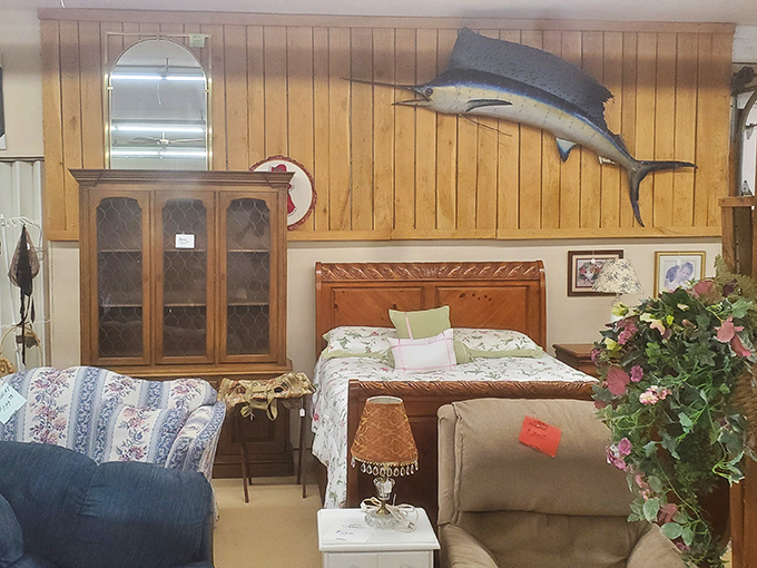 The mounted marlin watches over a bedroom display that somehow makes you nostalgic for a guest room you never had.