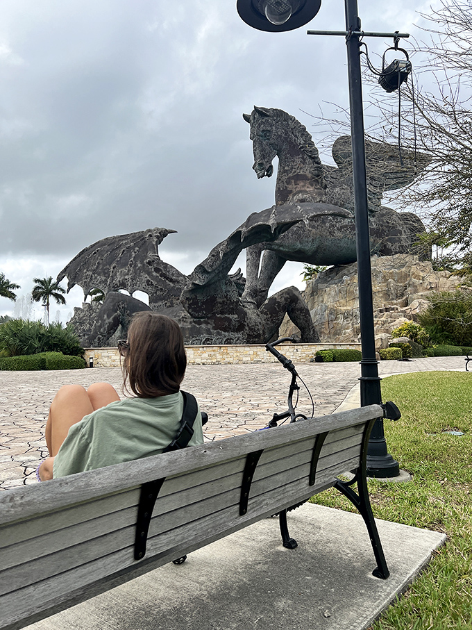 Contemplation bench with a view. Some people get park vistas, Hallandale Beach residents get legendary creatures locked in combat.