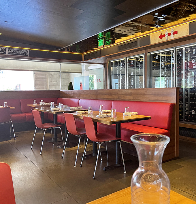 The red leather booths aren't just seating—they're front-row tickets to one of West Hollywood's most satisfying culinary performances.