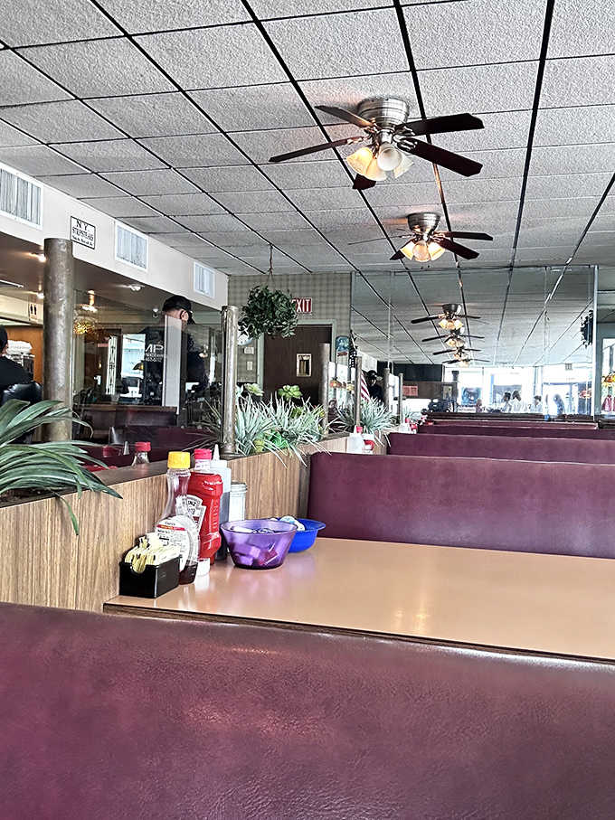 The tufted blue booths aren't just comfortable&mdash;they're practically begging you to settle in for another round of oysters and stories.