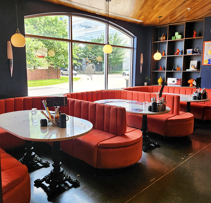 These coral booths aren't just seating&mdash;they're thrones from which to rule your breakfast kingdom while plotting your next pancake conquest.