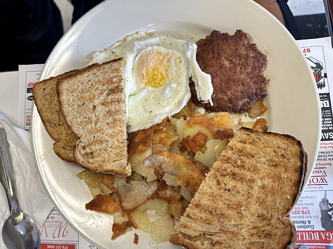 The breakfast trinity&mdash;eggs, toast, and home fries&mdash;executed with the kind of precision that makes Monday mornings bearable again.