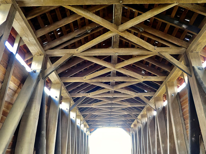 Look up to appreciate the genius of 19th-century engineering. These hand-hewn beams have sheltered travelers through countless storms.