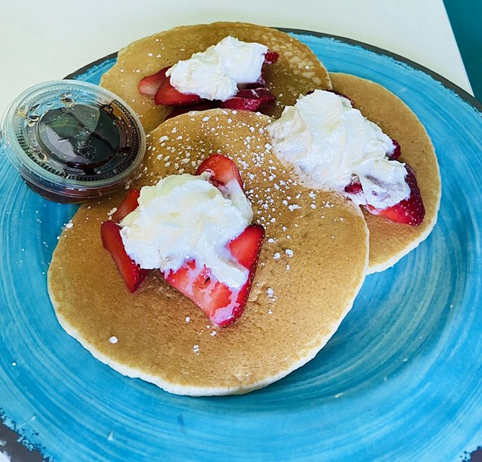 Pancake perfection with berry benefits! These fluffy discs topped with fresh strawberries and whipped cream make mornings worth waking up for.