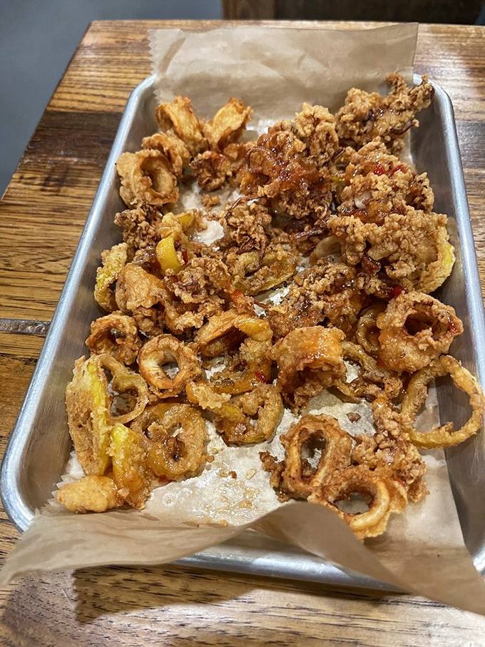Calamari that defies the rubbery reputation of lesser versions. Perfectly crisp, tender inside, and destined to disappear faster than Florida sunshine after a summer storm.