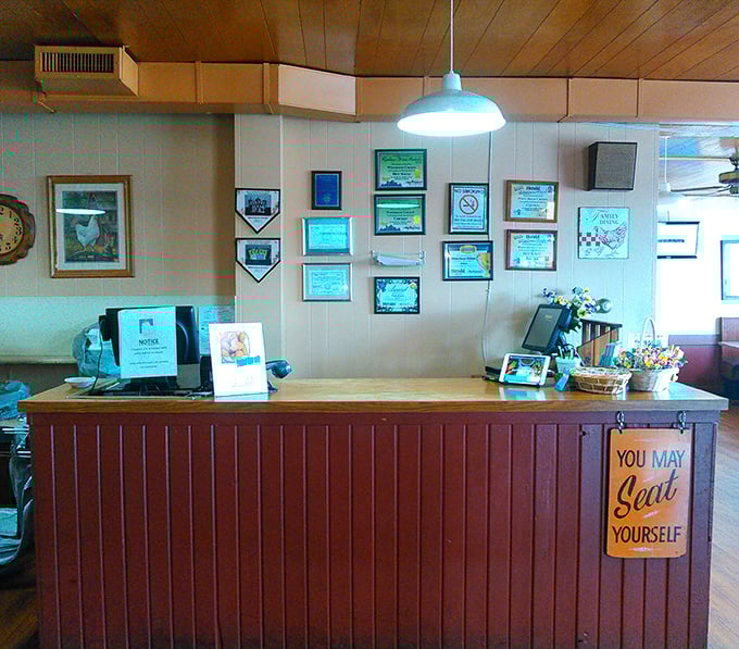 The command center where chicken dreams come true, decorated with awards that tell the delicious story.