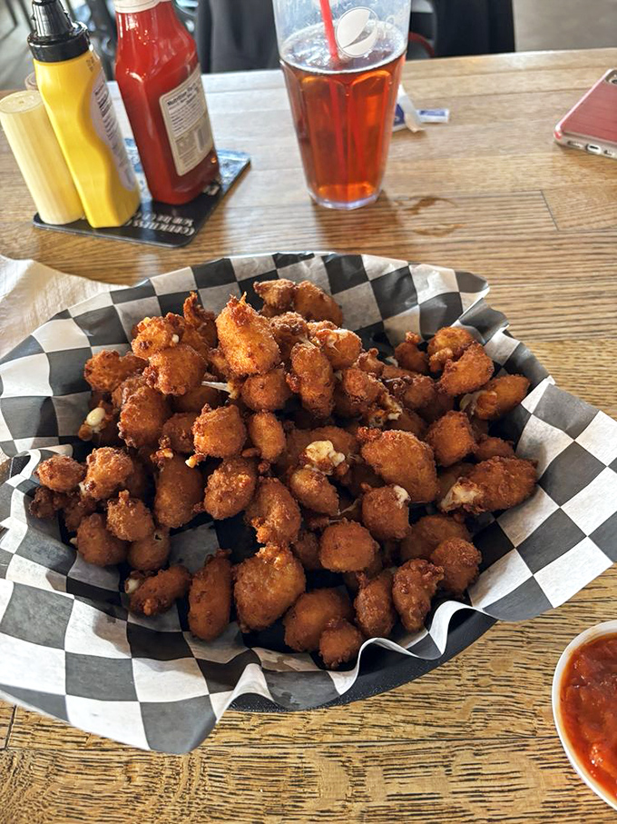 Tater tots dressed for a night on the town. Crispy potato nuggets elevated with melty cheese and pickles&mdash;childhood favorites all grown up.