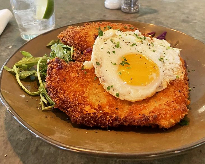 Schnitzel meets breakfast with this crispy masterpiece crowned with a sunny-side-up egg. Proof that brunch is the most ingenious meal ever invented.