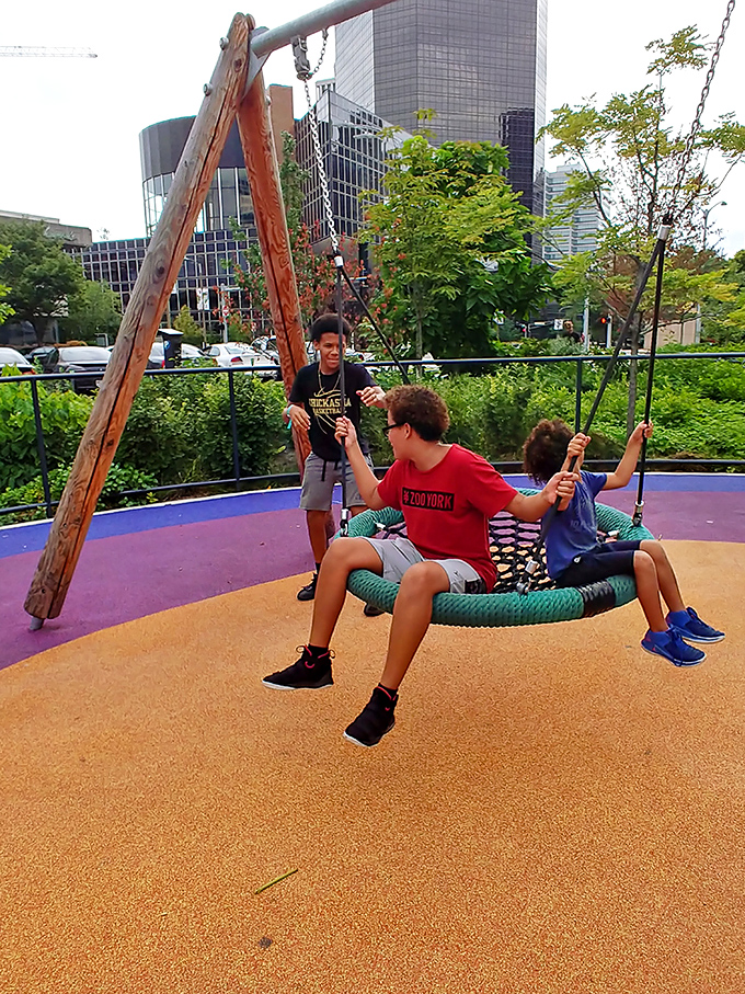 The park's playground features bring out the kid in everyone. This innovative swing design proves art and play make perfect partners.