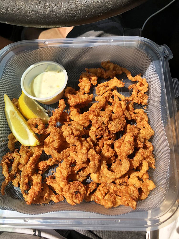 Clam strips so perfectly fried they'll make you forget every rubbery, disappointing version you've ever had. The lemon wedge isn't optional&mdash;it's essential.