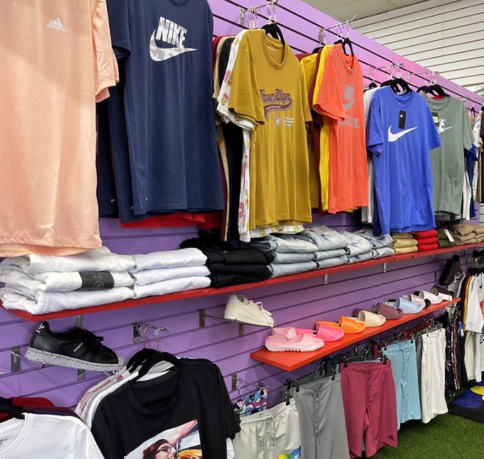 Brand names at bargain prices hang in chromatic order, a rainbow of cotton promising both style and savings to savvy shoppers.