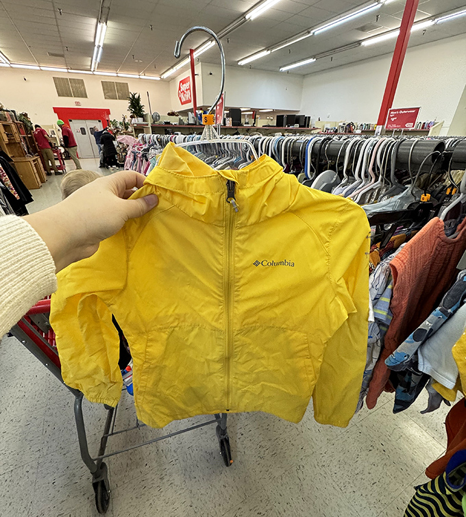Color-coded clothing racks: the organizational system that makes finding that perfect vintage flannel actually possible.
