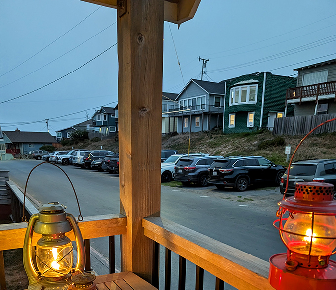 Lanterns glowing at dusk, the perfect front-row seat to watch day surrender to night in this peaceful coastal haven.