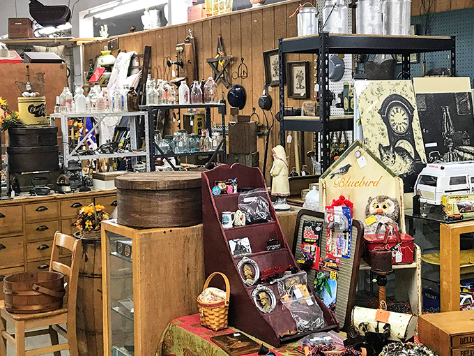 Every shelf tells a story in this booth where vintage clocks, antique barrels, and nostalgic signs create a perfectly curated corner of Americana.