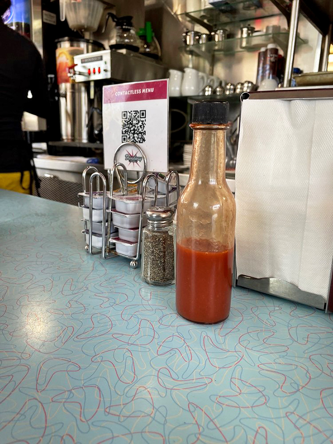 The holy trinity of diner condiments&mdash;hot sauce, pepper, and those little creamers that somehow make you feel like you're getting away with something.
