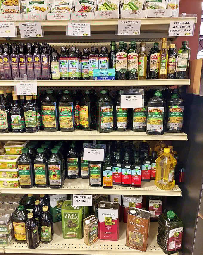 Olive oil bottles stand like sophisticated sentinels among everyday cooking essentials&mdash;gourmet ingredients without the gourmet markup.